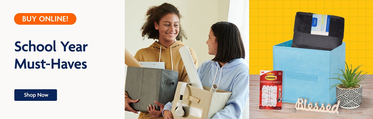Two college students smiling while carrying bins full of back-to-campus ...