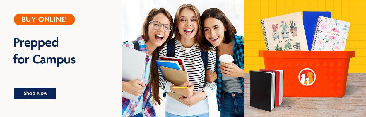Three students holding school supplies next to a table topped with red ...