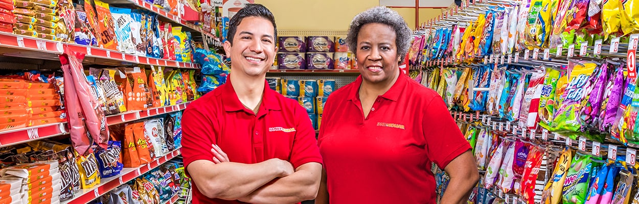 Male and female associates in red Family Dollar shirts standing in the ...